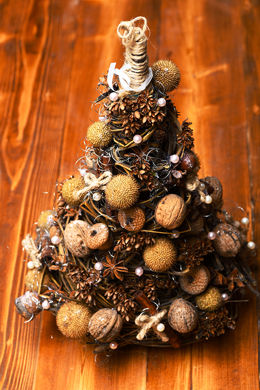 Fir tree decorated with nuts, dry anise and acorns. - MidWest Outdoors